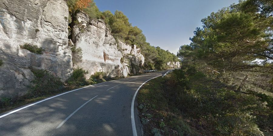 A paved road to the iconic La Mussara